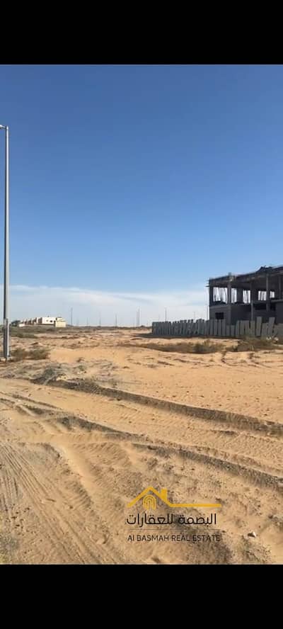 For sale in Sharjah, Rawdat Al Qart project, two adjacent plots of land ...