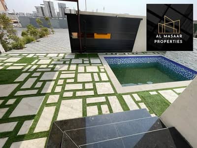 An excellent modern villa with a swimming pool, a stone facade, and a ...