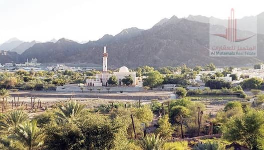 Own a large residential plot of land in Masfout, Basin 8 - Distinctive ...