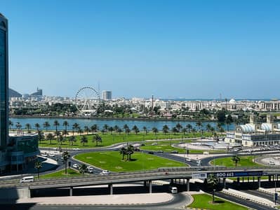 Free parking | Balcony with open lake view | Al Majaz park view | Bayut.com