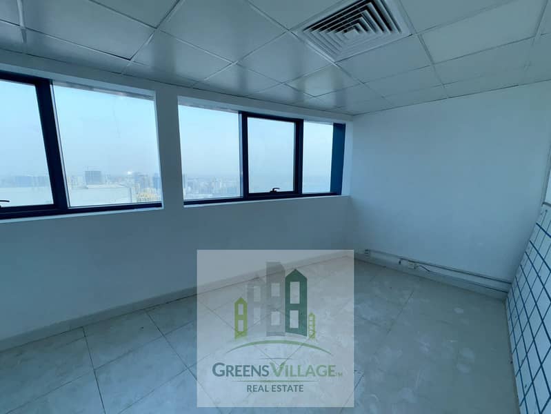 spacious office for rent in falcon tower with partitions in rashidiya area, ajman. | Bayut.com