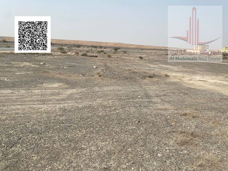 Commercial land for sale in Al Manama, Ajman, in a prime location and ...