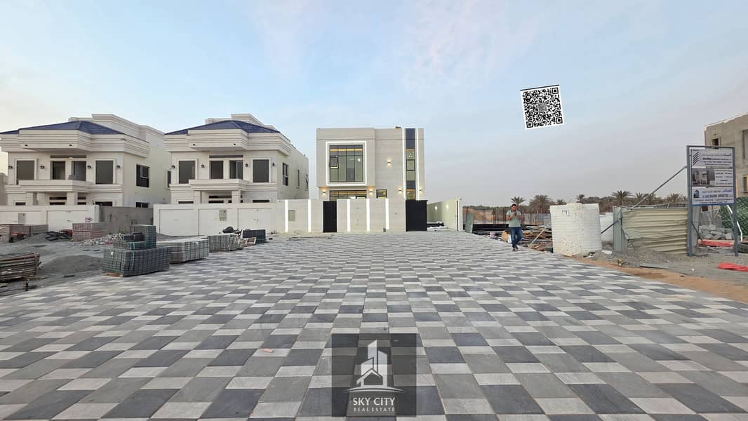 Modern villa on a main street with a very large setback and fully ...