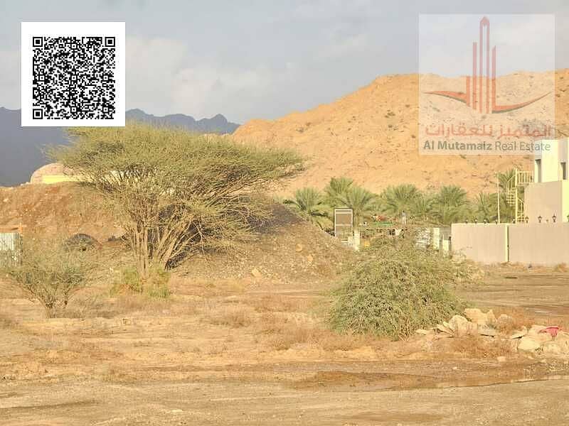 Two adjacent plots in Masfout 8, a great location ready for ...