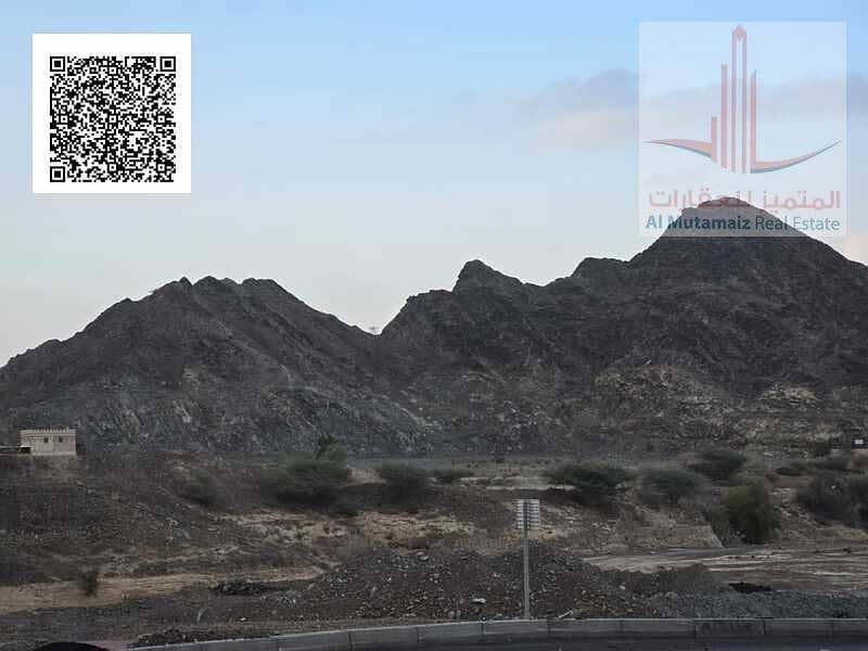 Two adjacent plots in Masfout 8, a great location ready for ...