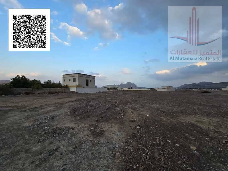 Two adjacent plots in Masfout 8, a great location ready for ...