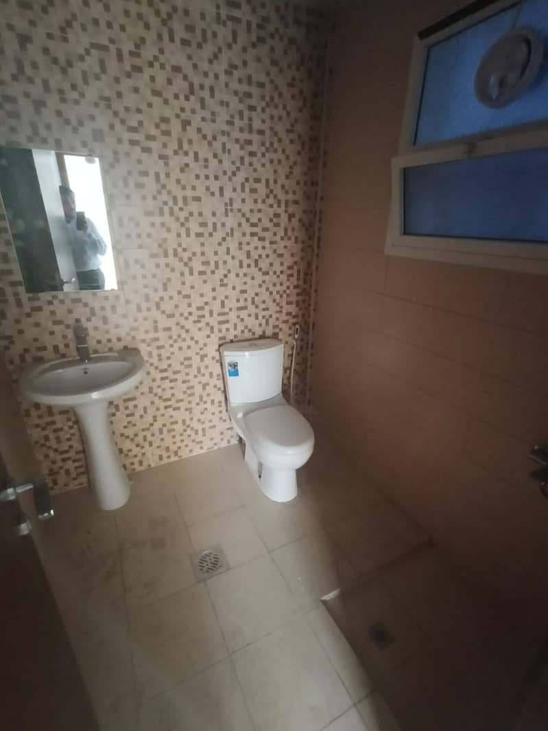 A one-bedroom apartment with a living room, bathroom, and open balcony ...