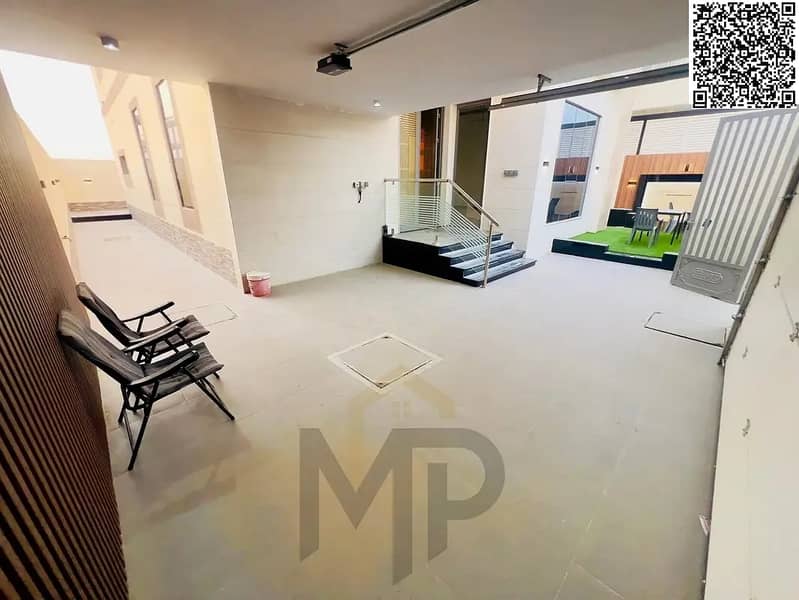 Luxury villa for sale in Al Bahia area, featuring two floors and a ...