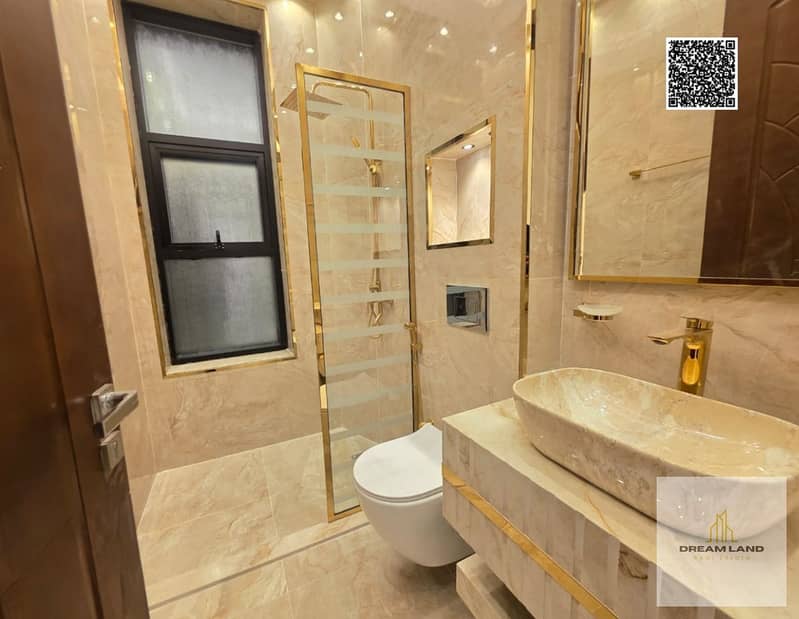 A luxurious, modern corner villa with a full stone facade and an ultra ...