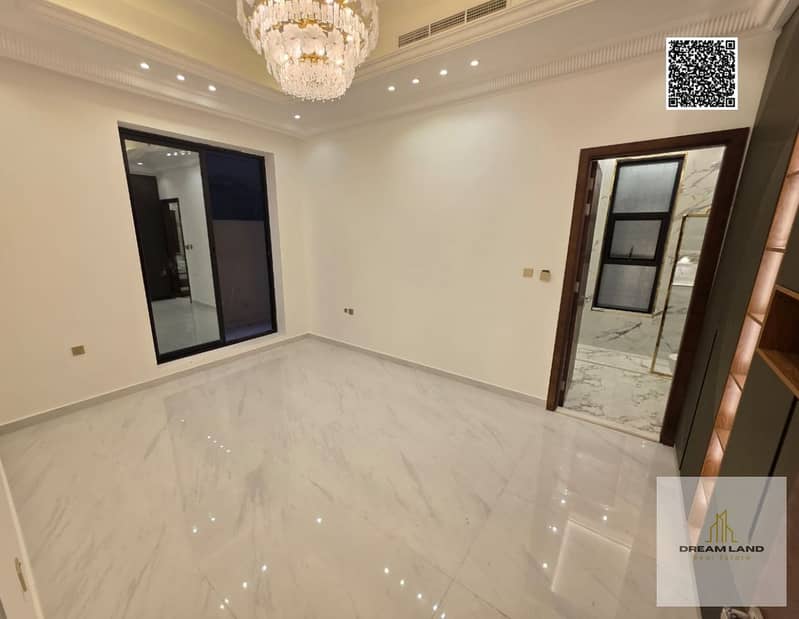 A luxurious, modern corner villa with a full stone facade and an ultra ...