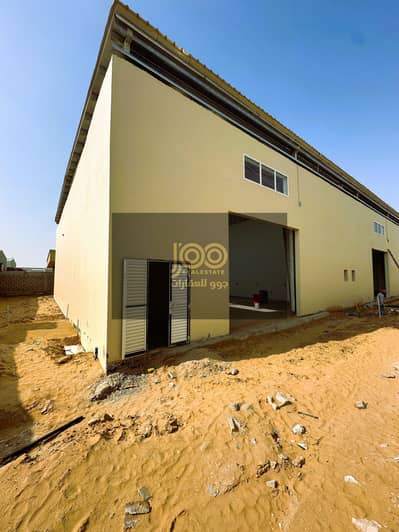 A complex consisting of warehouses and a large plot of land ...