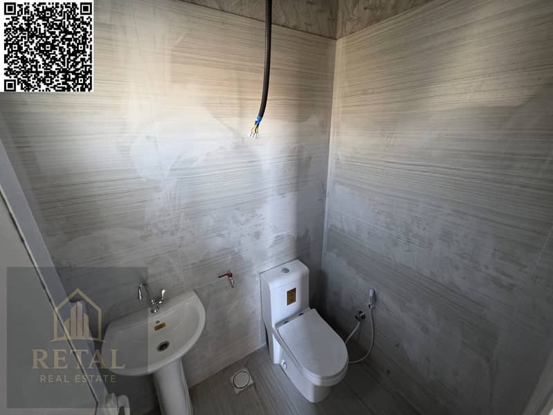 It is located on the main street, with a large sidewalk in front of it ...