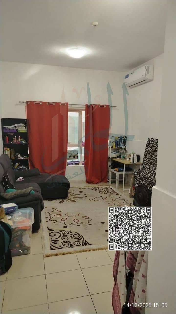 One bedroom and living room for sale in Lulu Towers Ajman complex with ...