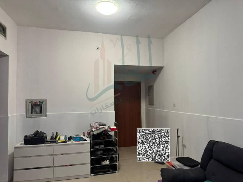 One bedroom and living room for sale in Lulu Towers Ajman complex with ...