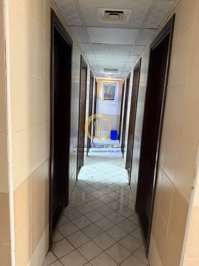 Land with a ground floor and first floor building and 6 warehouses on a ...