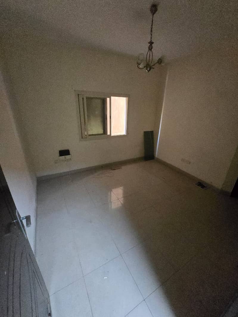 A large apartment with one bedroom and a living room, a separate living ...