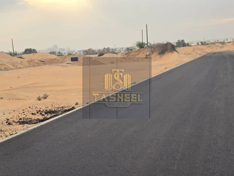 Large townhouse plot opposite a park and mosque in Al Zahia, street and ...