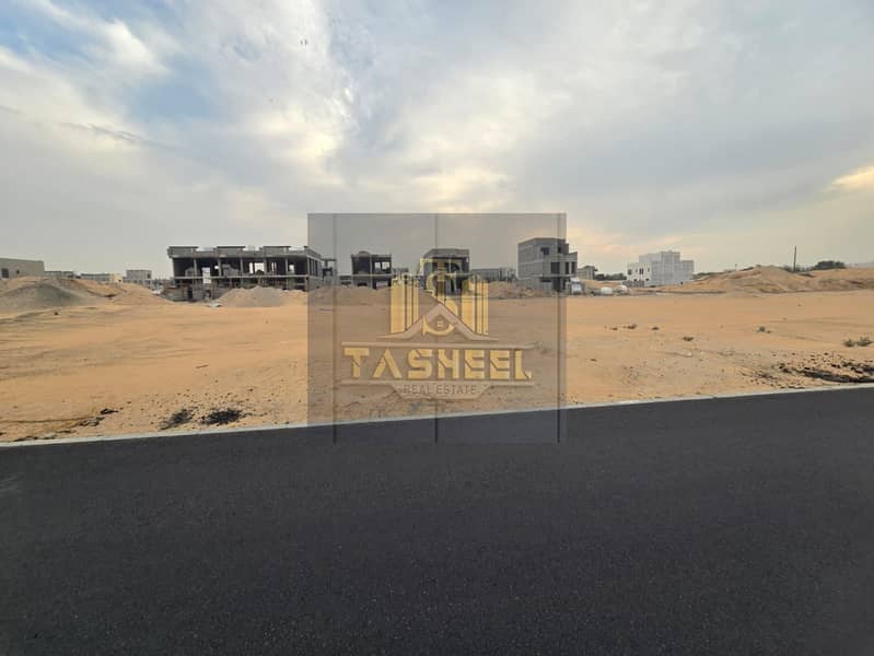 Large townhouse plot opposite a park and mosque in Al Zahia, street and ...