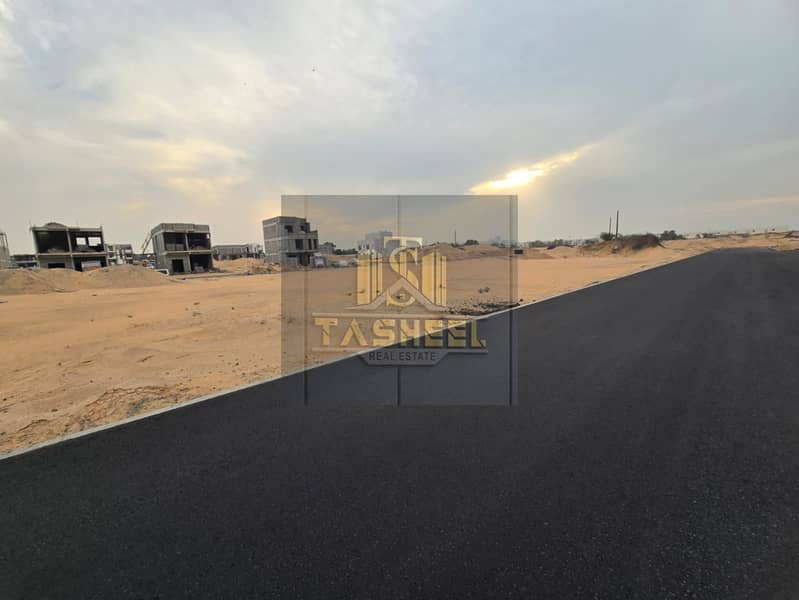 Large townhouse plot opposite a park and mosque in Al Zahia, street and ...