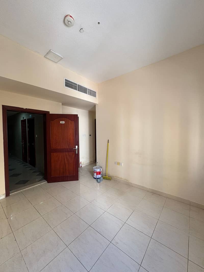 One bedroom and living room in a very clean and beautiful building ...