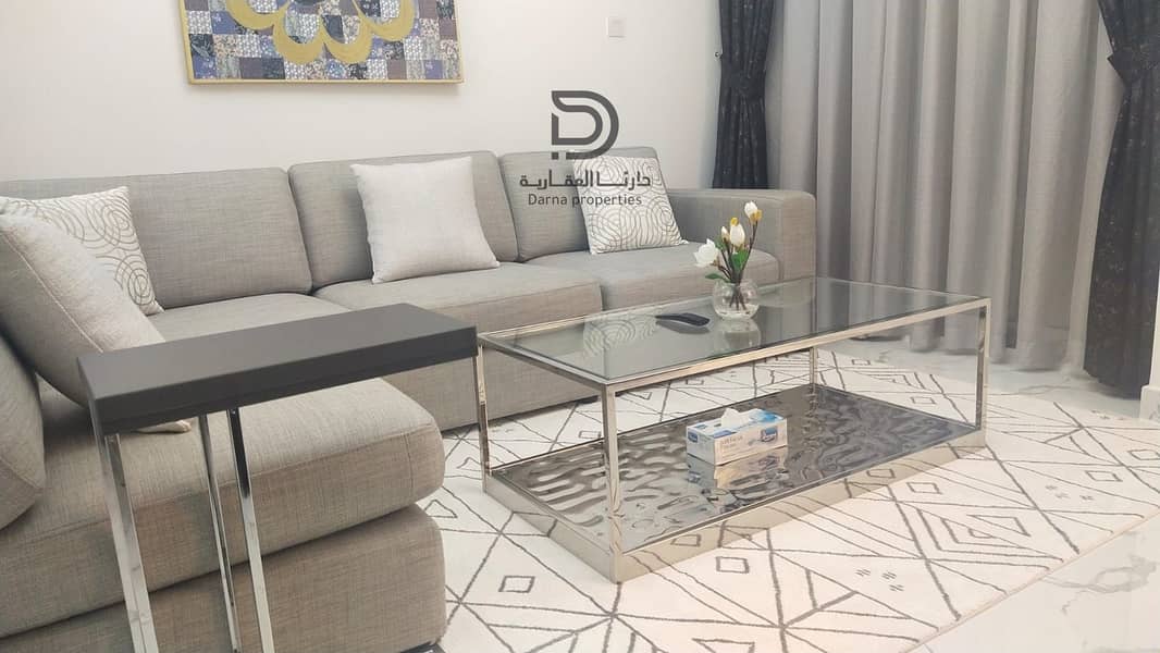 Own a spacious 2-bedroom apartment with living room in Al Waha Towers ...