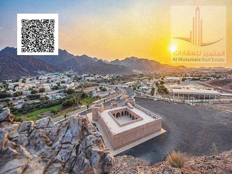 Own land with a beautiful view in Masfout 1 - suitable location for ...