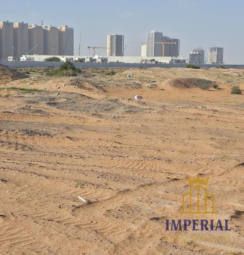 Land for development in the heart of Al Amerah - Ajman, directly behind ...